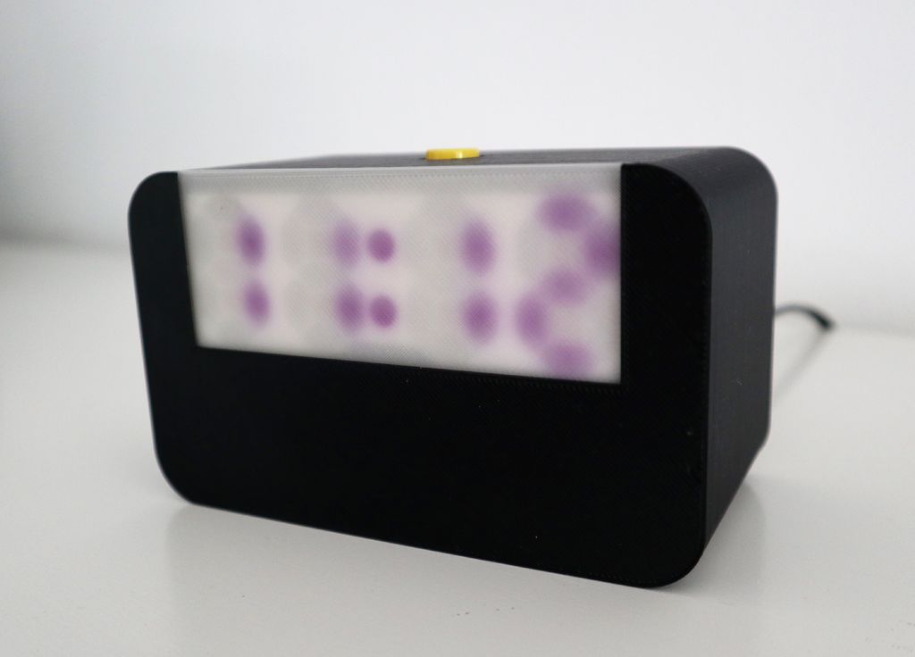 This clock tells time on a photochromic display | Arduino Blog