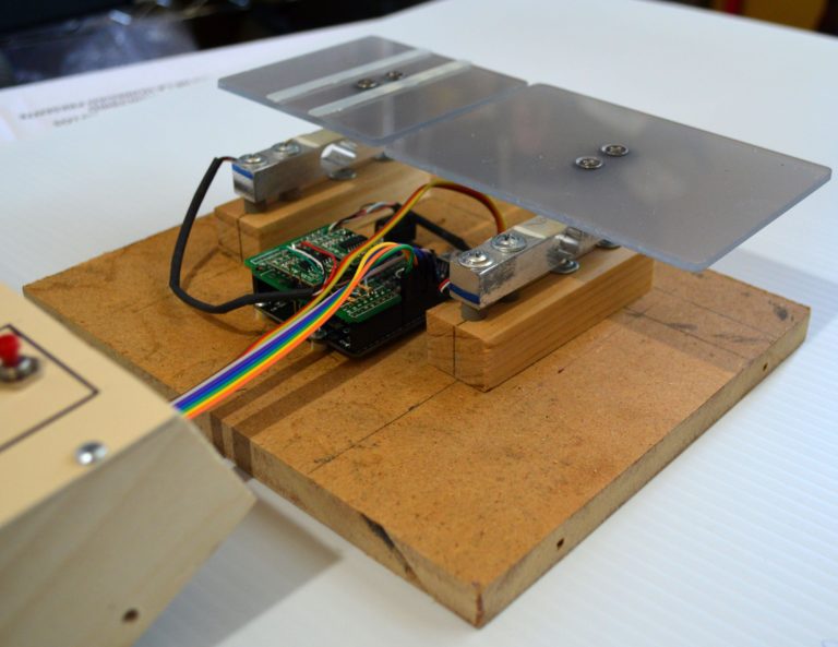 Arduino-powered pinewood derby car scale measures center of gravity ...