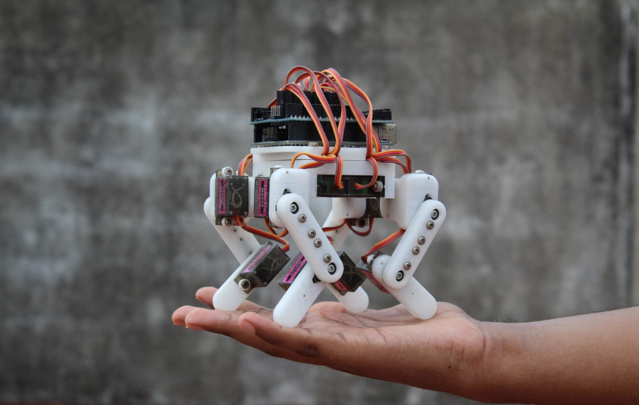 An Arduino-powered micro quadruped that fits in the palm of your hand ...