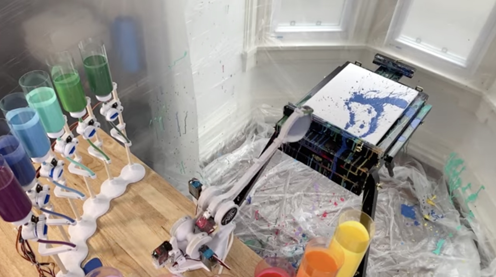 Flingbot is a robot that flings paint at a canvas to create art ...