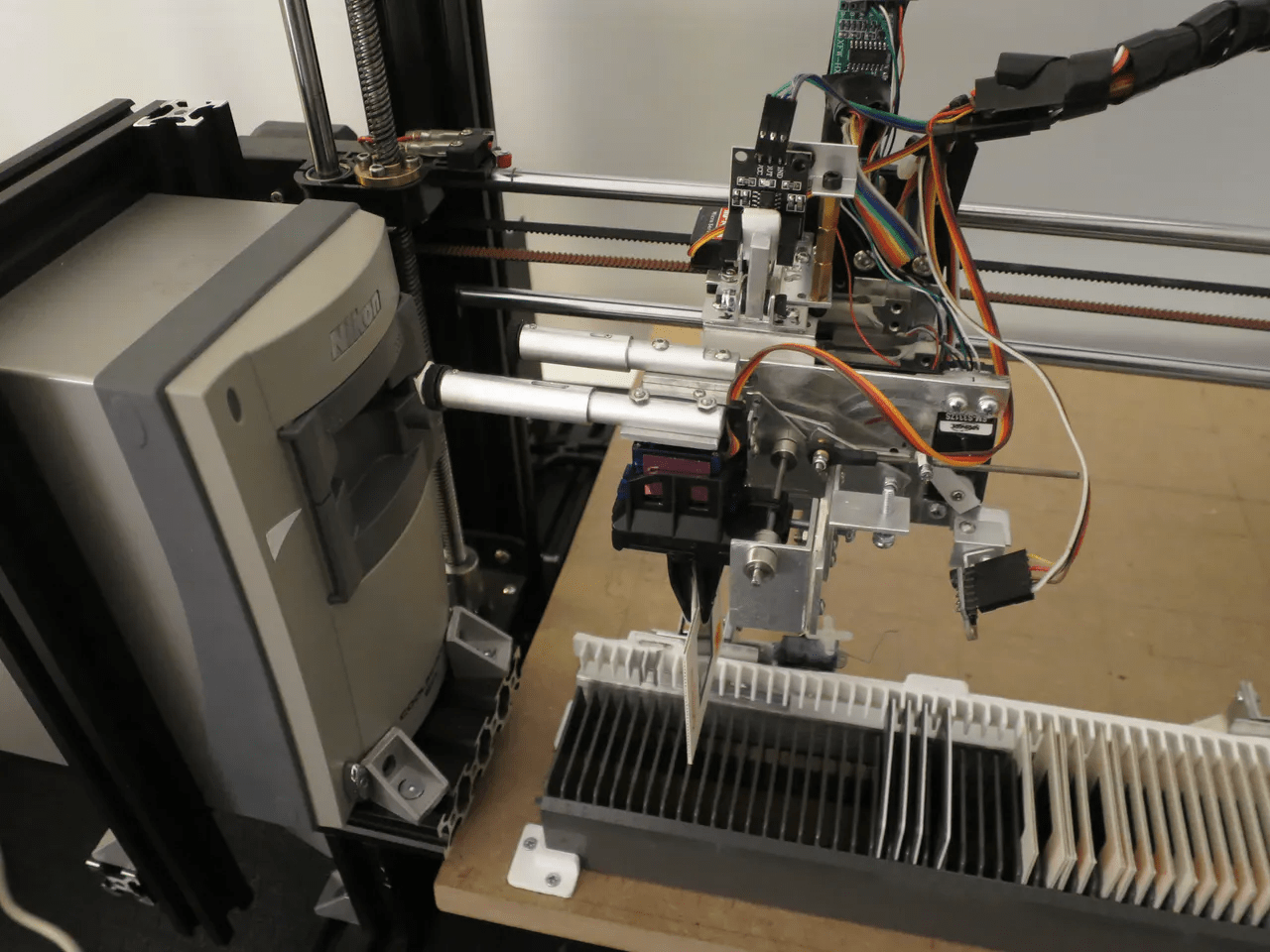 This robotic system automatically scans film slides on its own ...