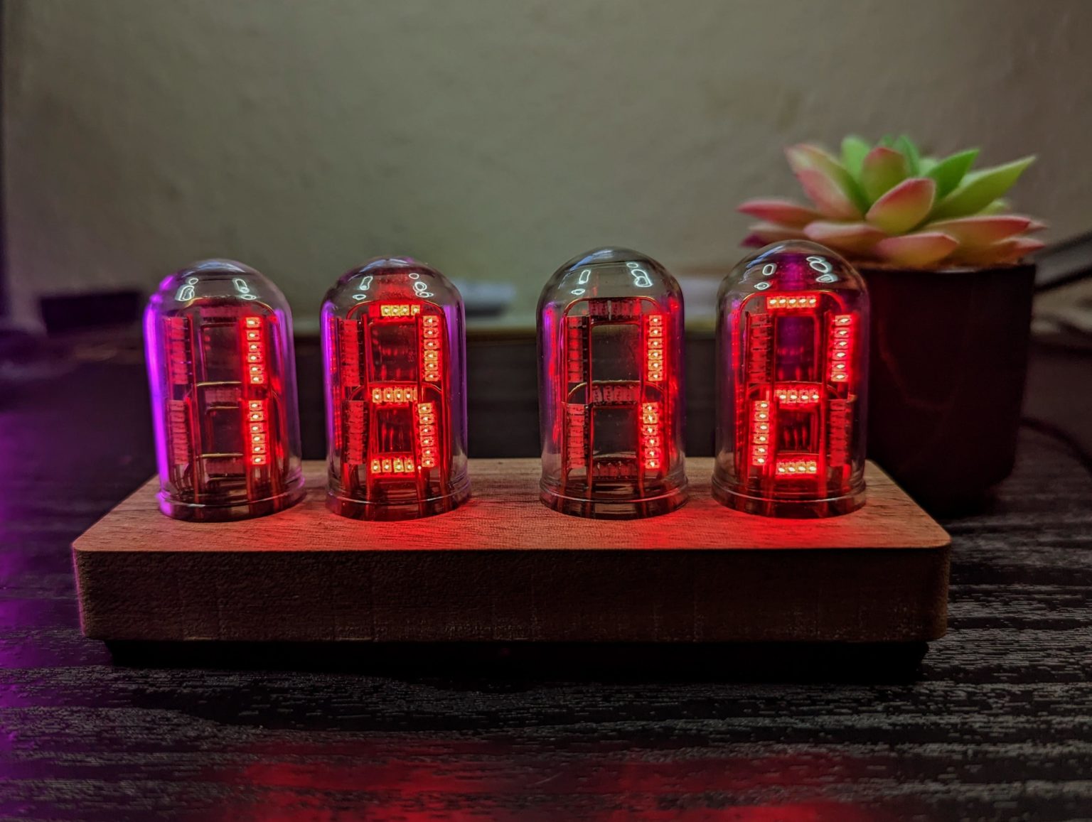 This beautiful clock features circuit sculpture faux Nixie tubes ...